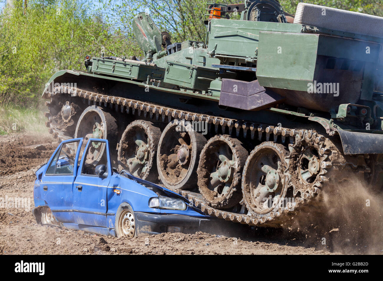 military tank crushes a blue car Stock Photo - Alamy