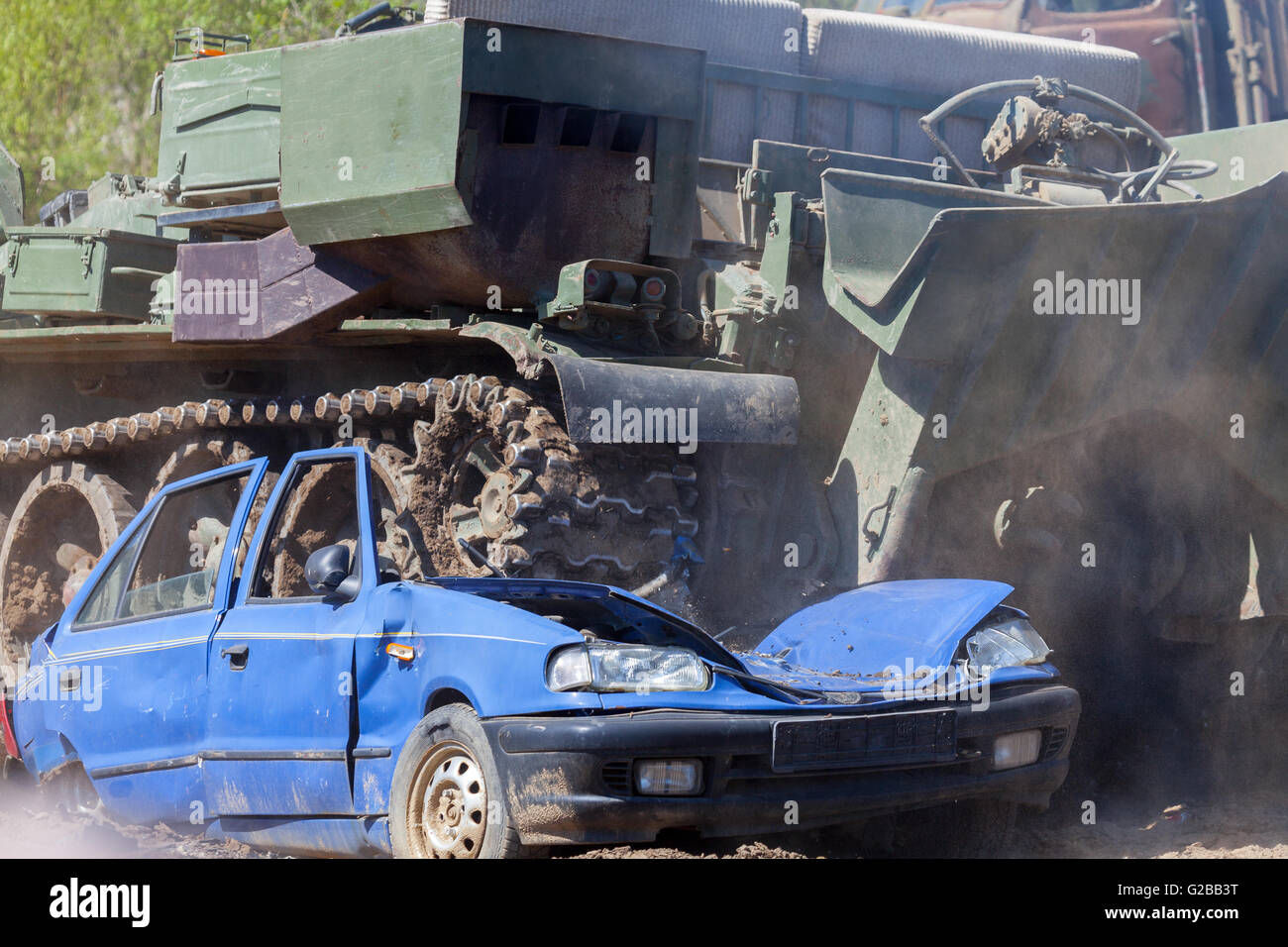 military tank crushes a blue car Stock Photo - Alamy