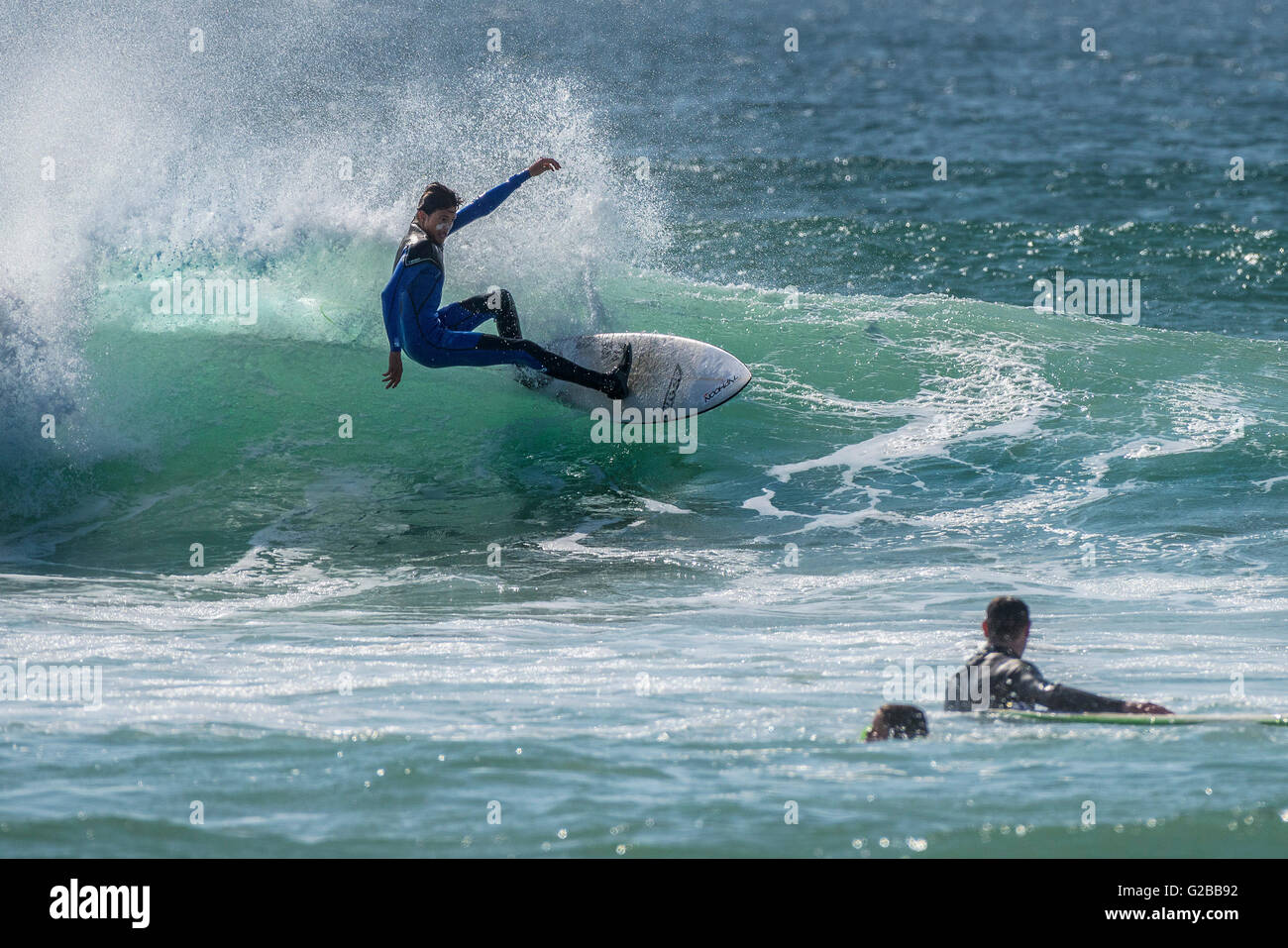 A surfer in spectacular action at Fistral in Newquay, Cornwall. UK ...