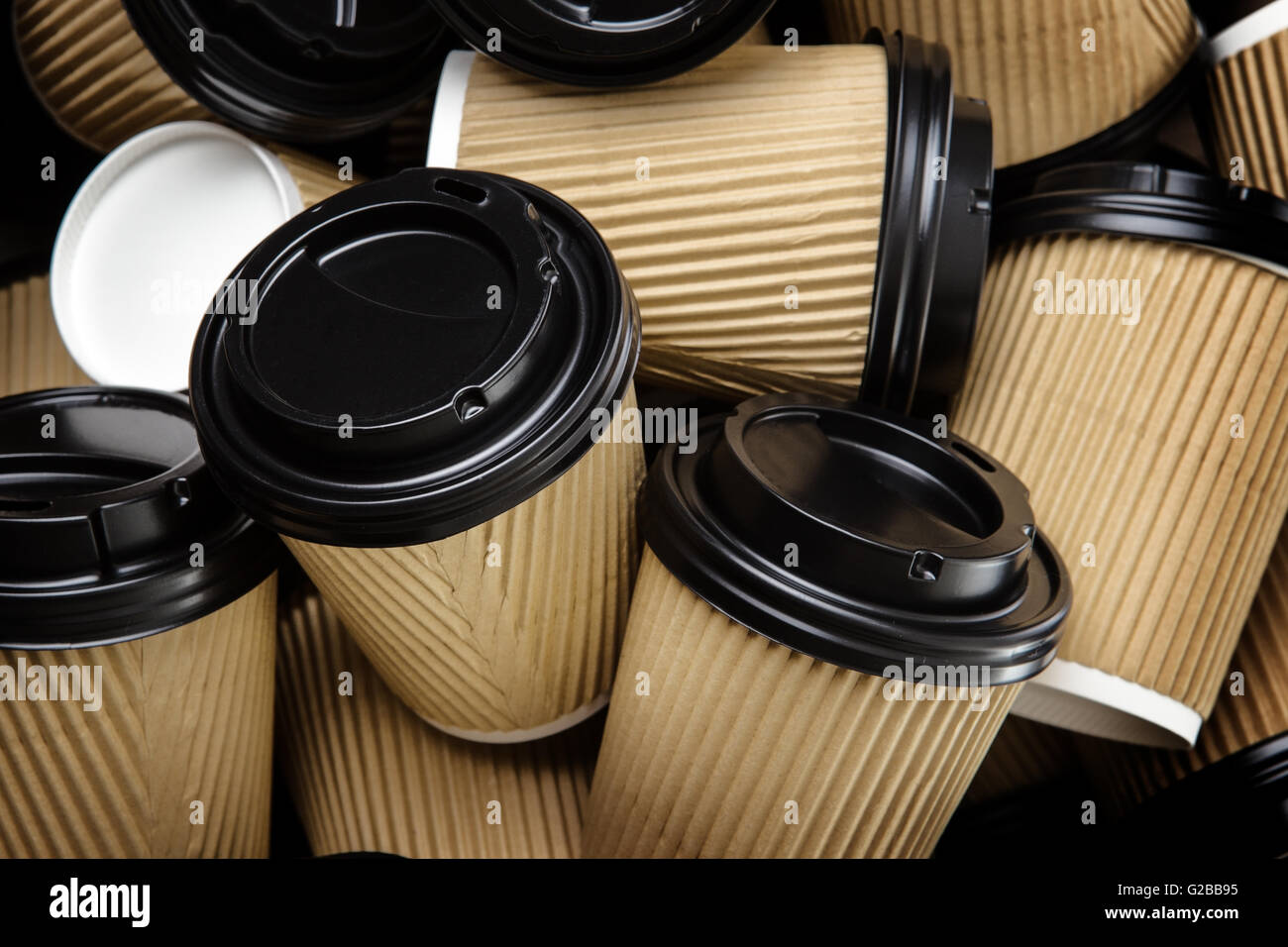 Pile of disposable take away coffee/ tea cups with black lids Stock ...