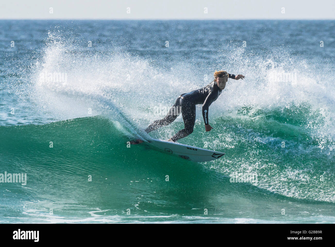 A surfer in spectacular action at Fistral in Newquay, Cornwall. UK ...