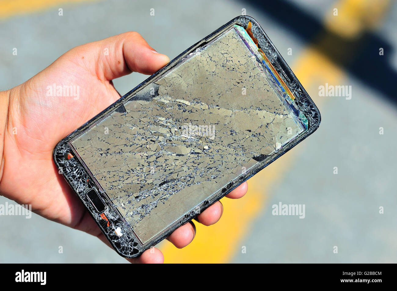 An Broken damage mobile in sun light Stock Photo - Alamy