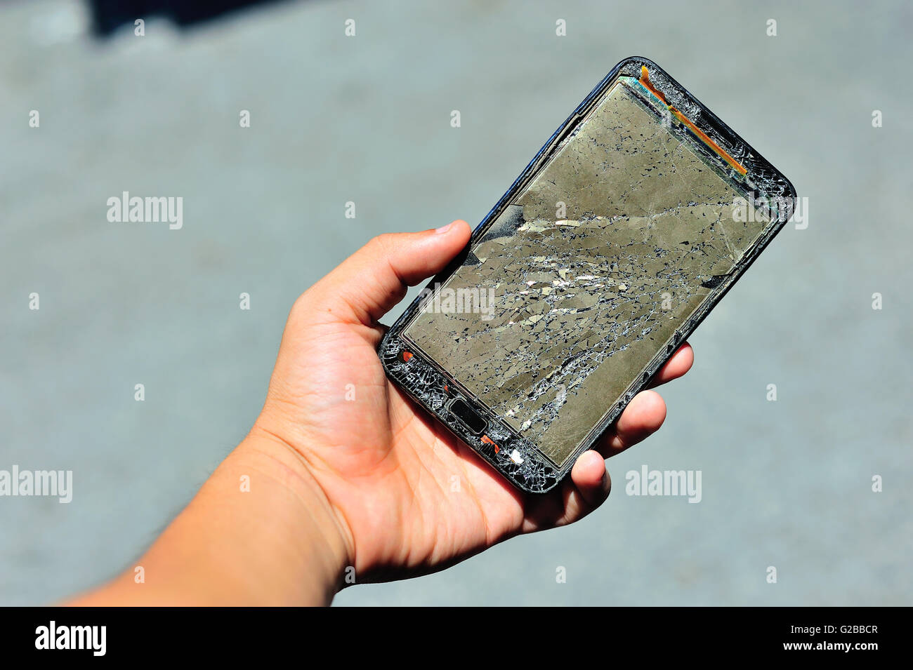 An Broken damage mobile in sun light Stock Photo - Alamy