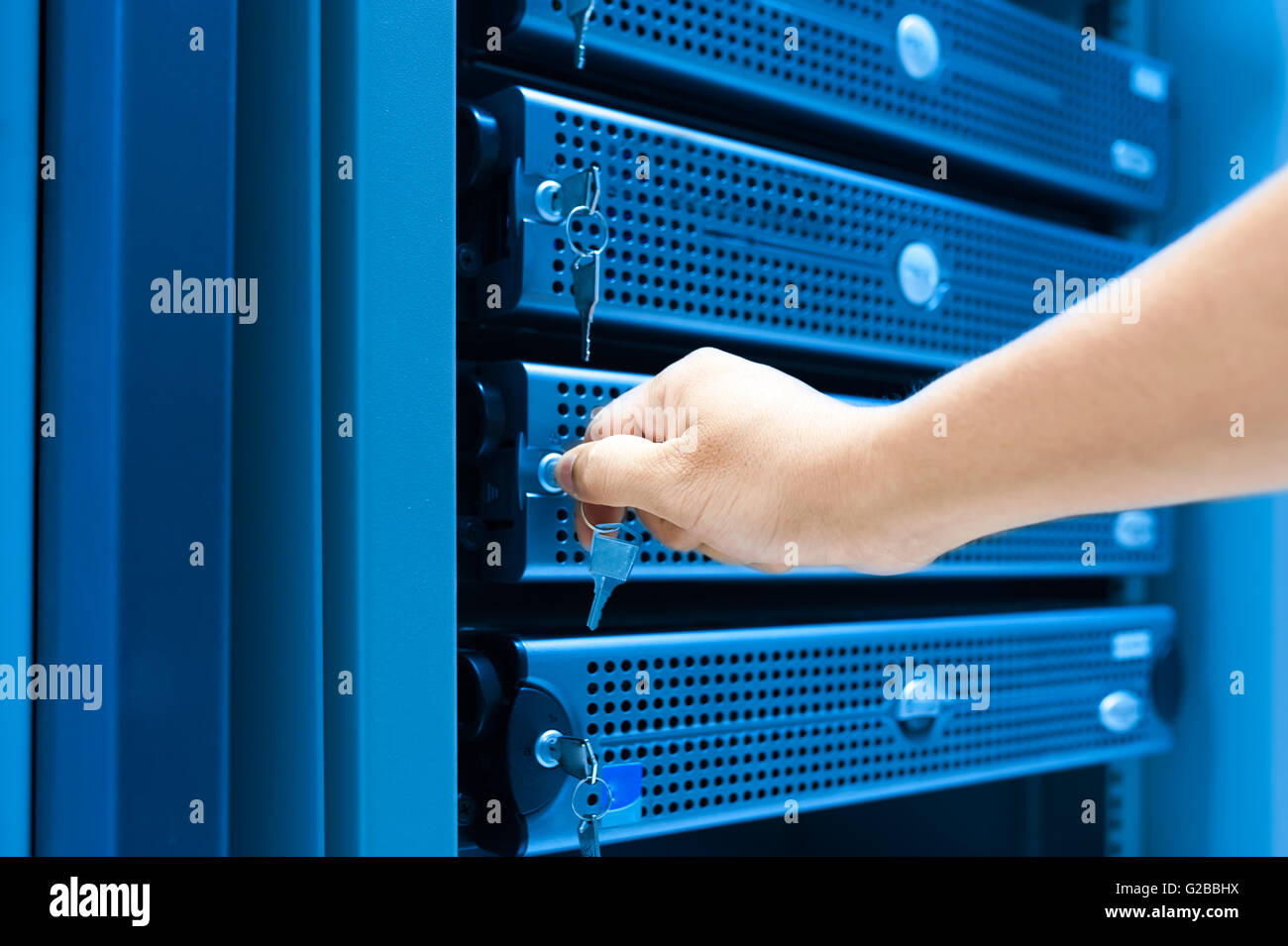 Man fix server network in data center room Stock Photo - Alamy