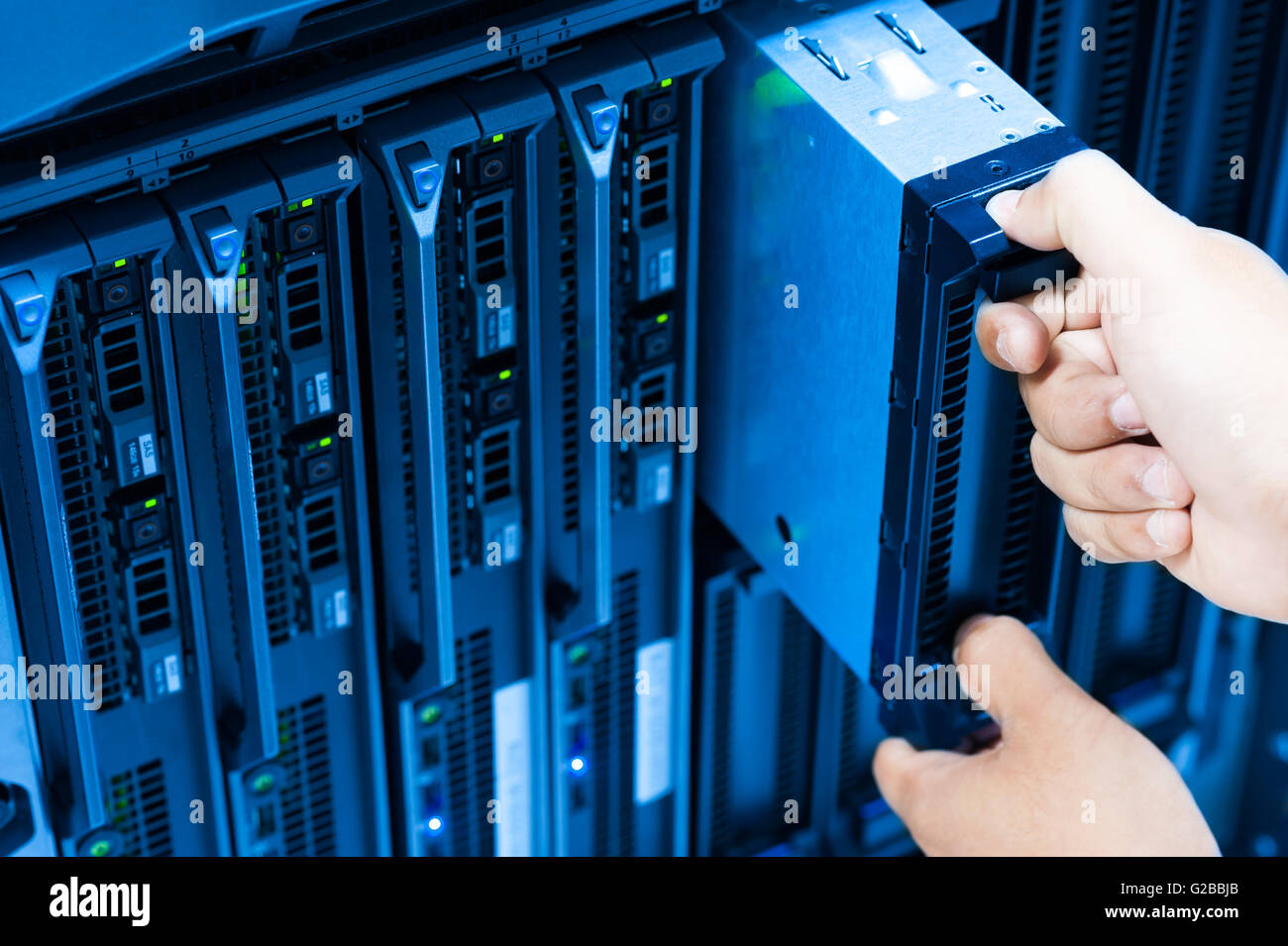 Man fix server network in data center room Stock Photo - Alamy
