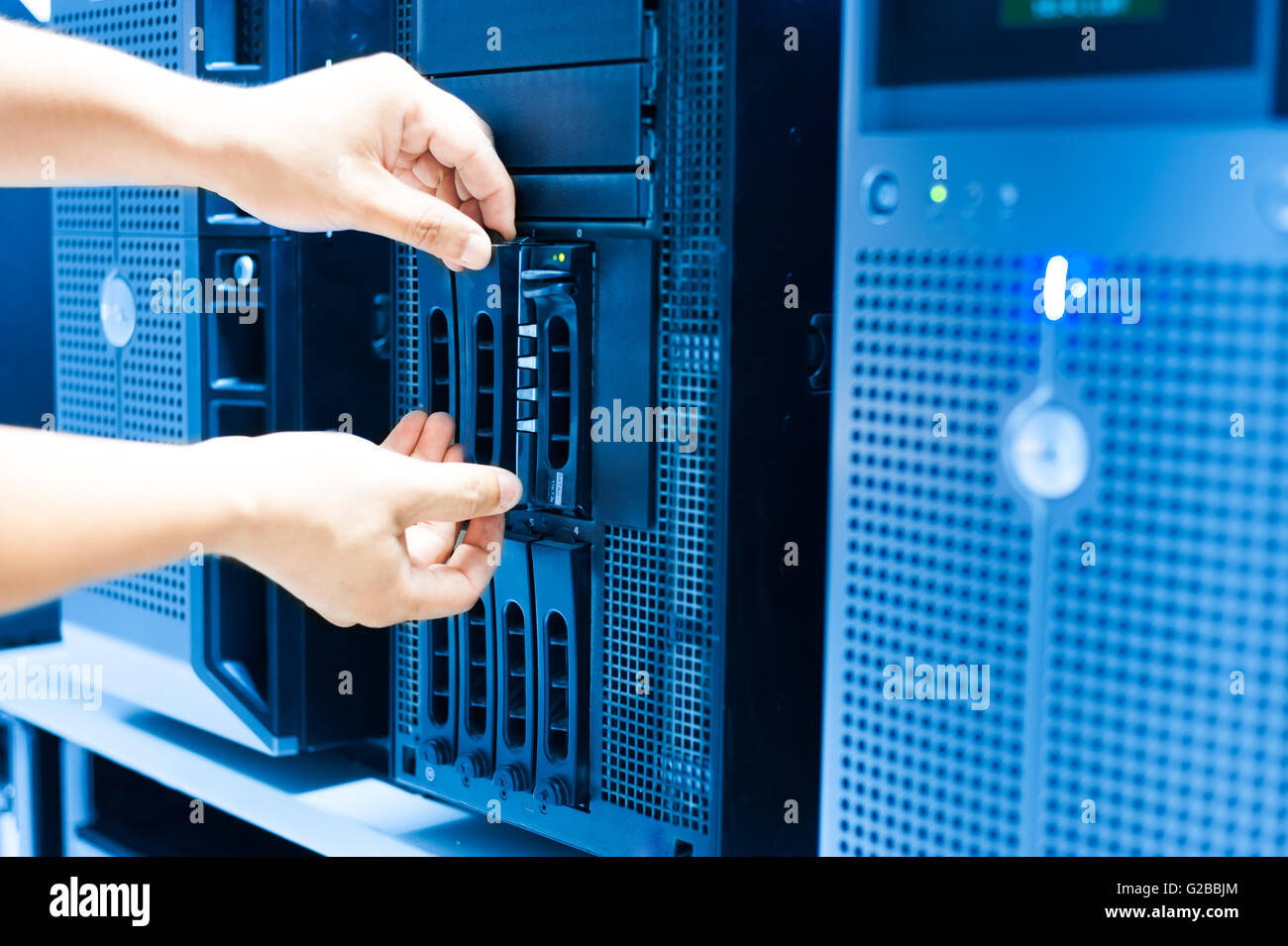 Man fix server network in data center room Stock Photo - Alamy