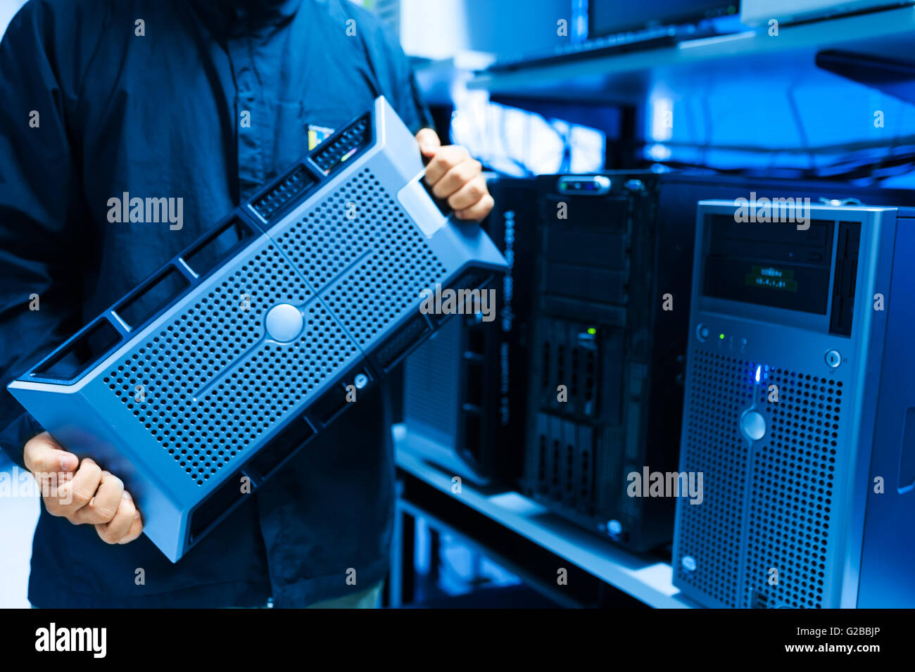 Man fix server network in data center room Stock Photo - Alamy
