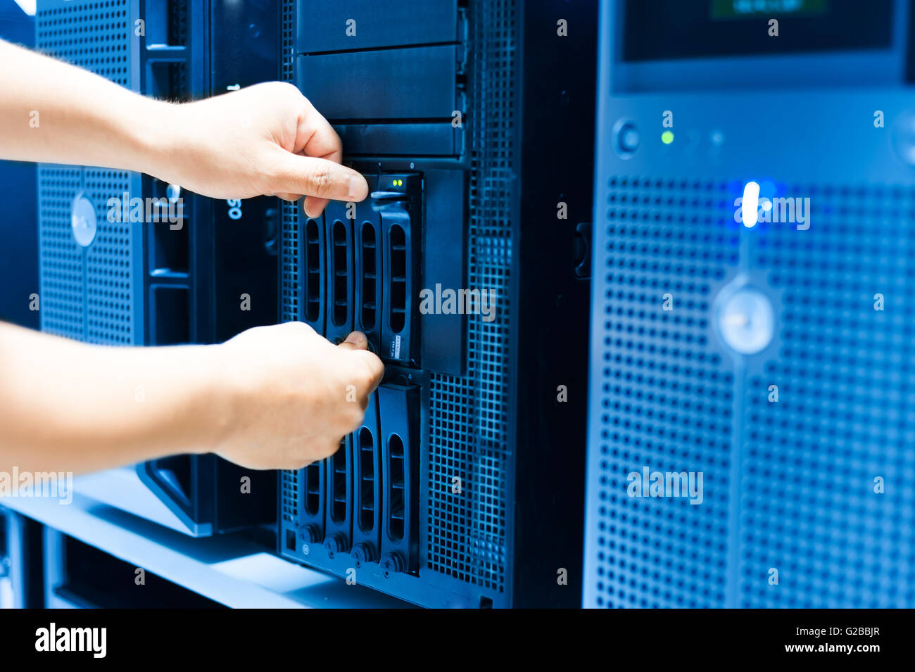 Man fix server network in data center room Stock Photo - Alamy