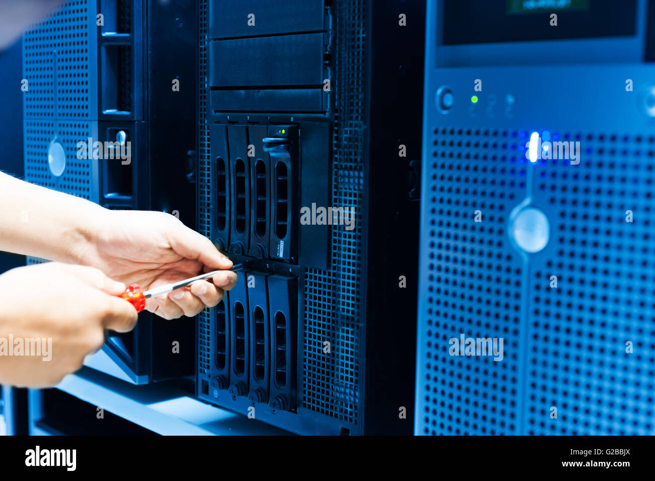 Man fix server network in data center room Stock Photo - Alamy