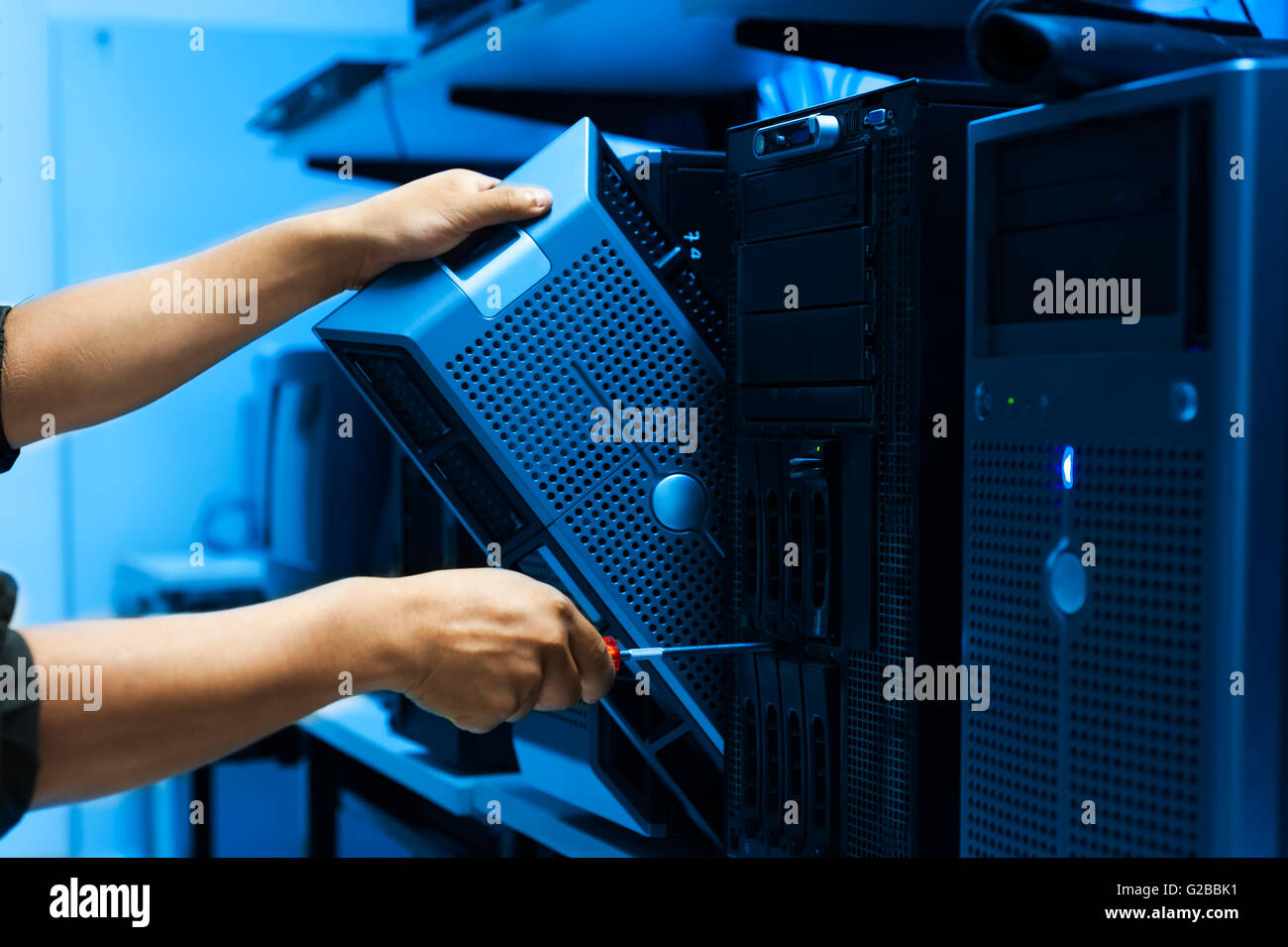 Man fix server network in data center room Stock Photo - Alamy