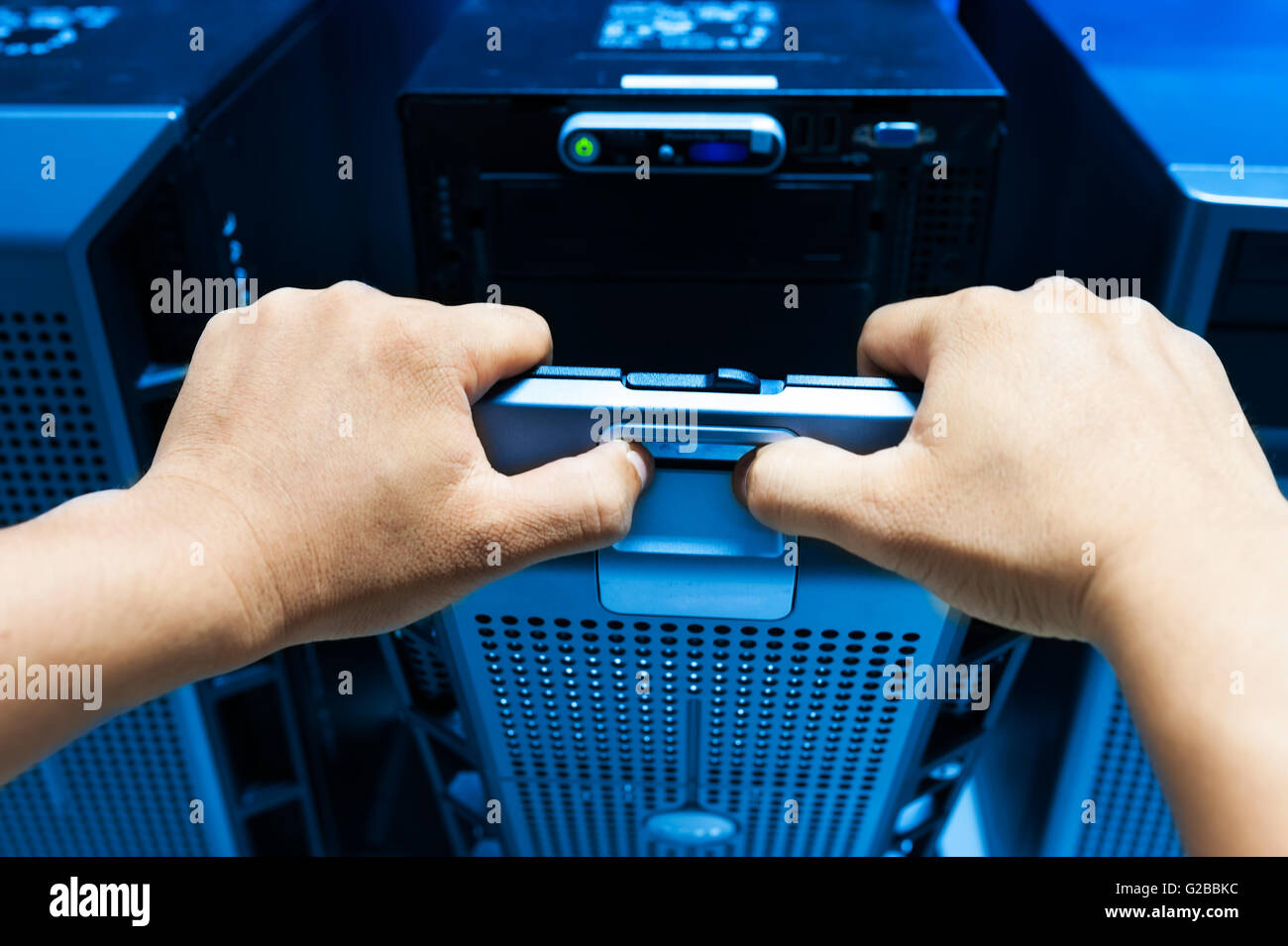 Man fix server network in data center room Stock Photo - Alamy