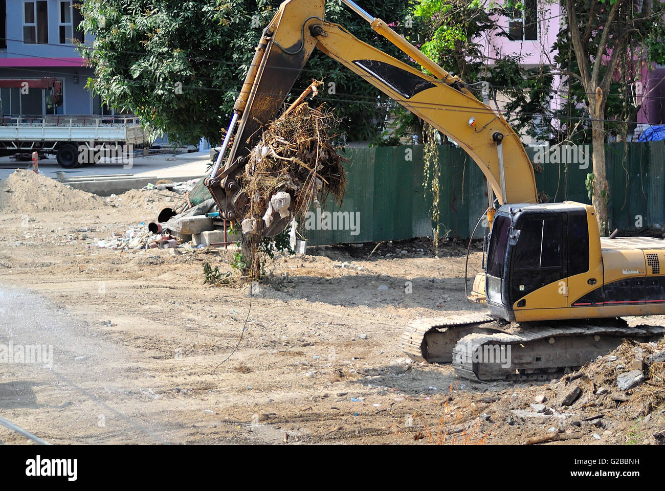 An excavator on a construction site Stock Photo - Alamy