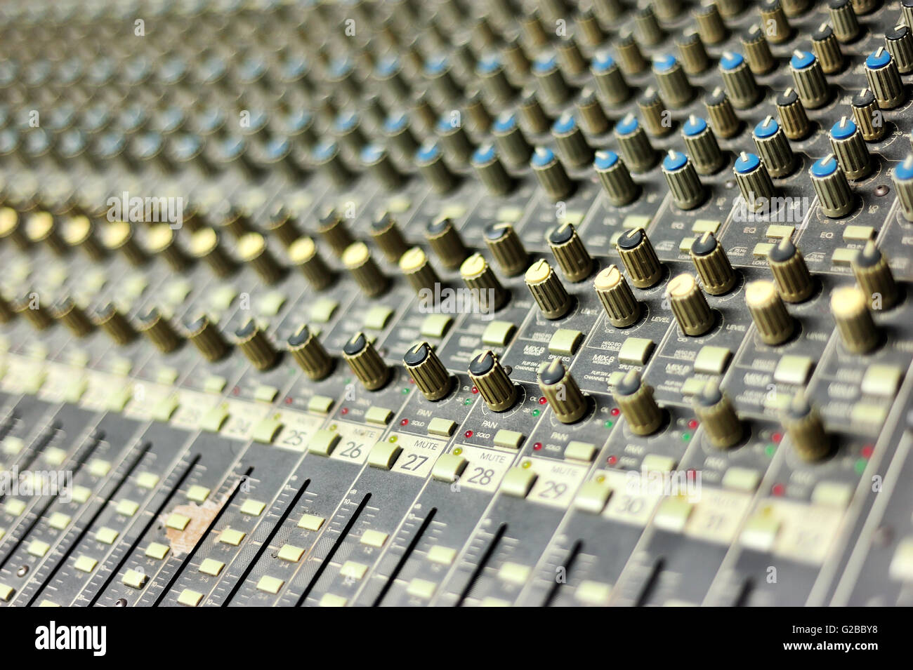 An Audio mixing table in soft light Stock Photo - Alamy