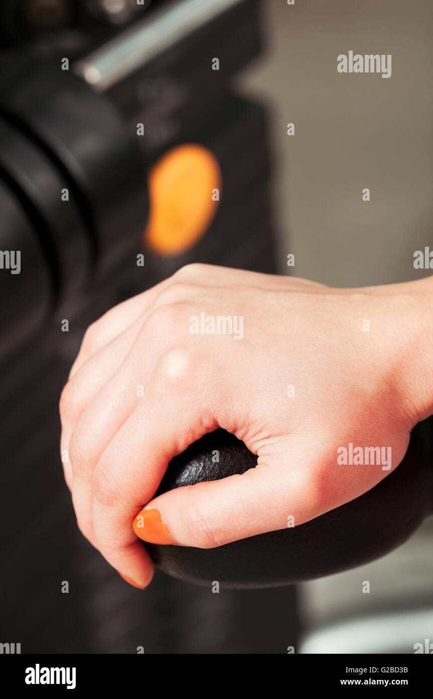 Close-up of woman hand pushing gym handle equipment for triceps ...