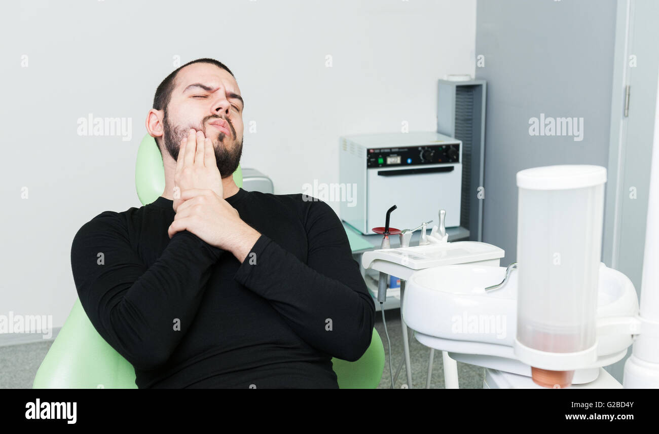 Nervous and stressed patient at dentist feeling toothache Stock Photo ...