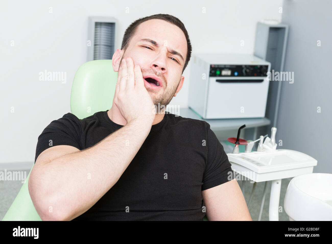 Male dentist patient suffering toothache or tooth pain Stock Photo - Alamy