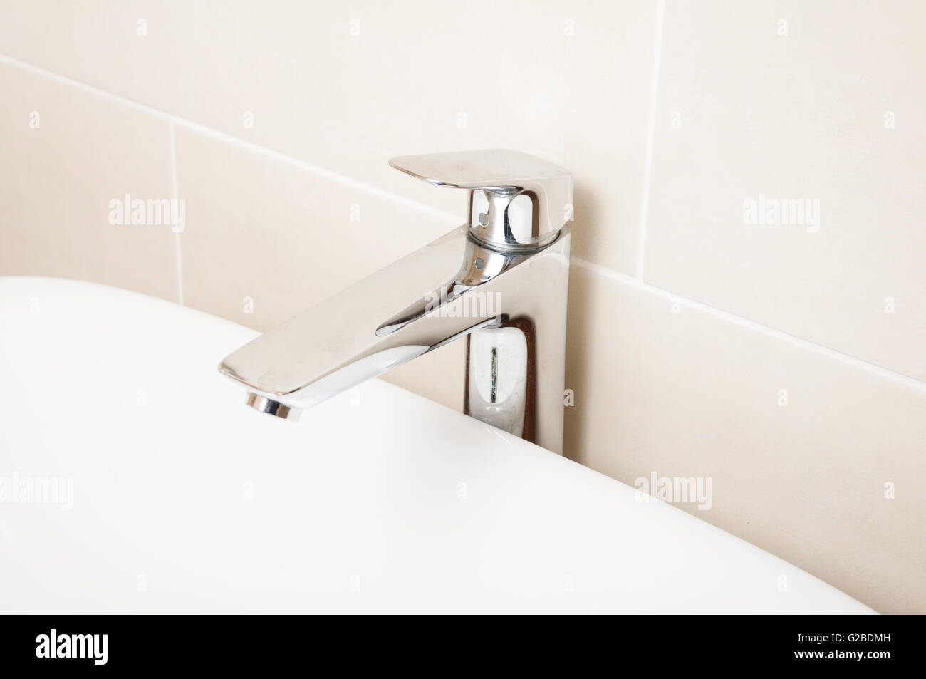 Closeup of shiny tap in a bathroom as hygiene concept Stock Photo - Alamy