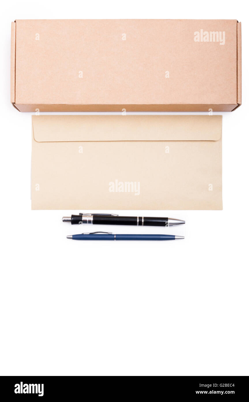 Office table with writing tools, carton box and brown envelope with ...
