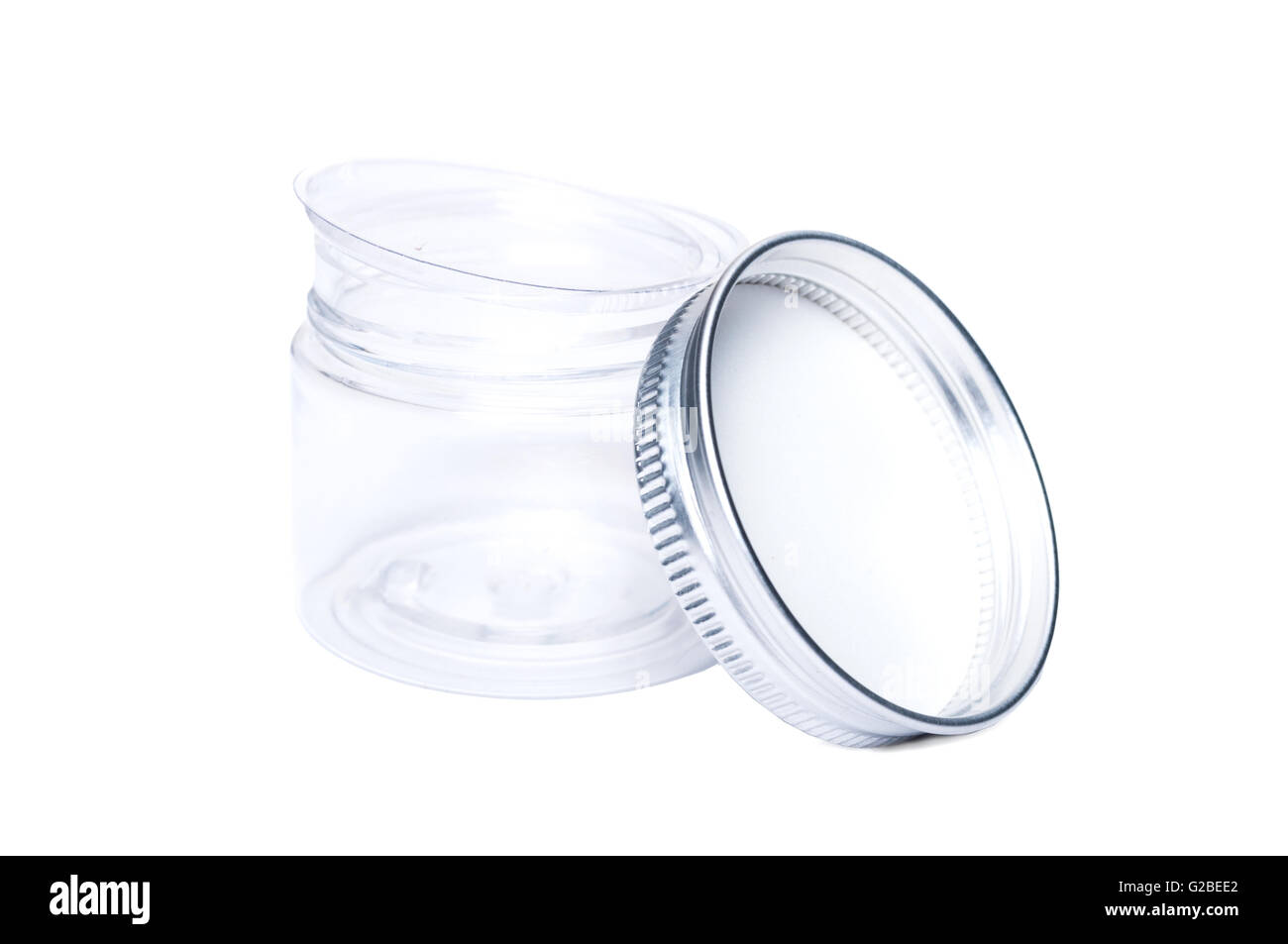 Open plastic jar with metal lid or cap isolated on white background ...