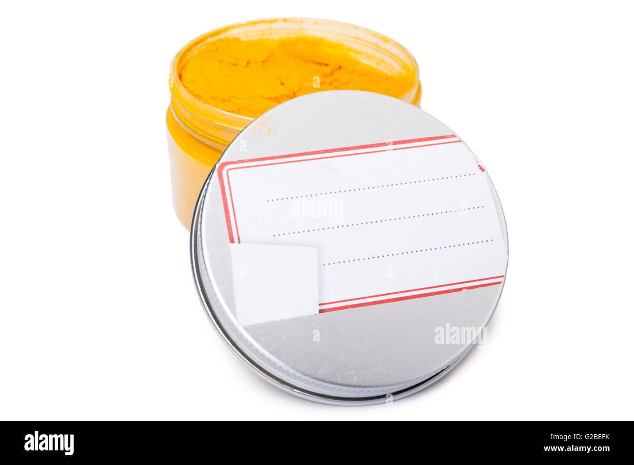 Yellow spicy indian turmeric in transparent jar or storage container ...