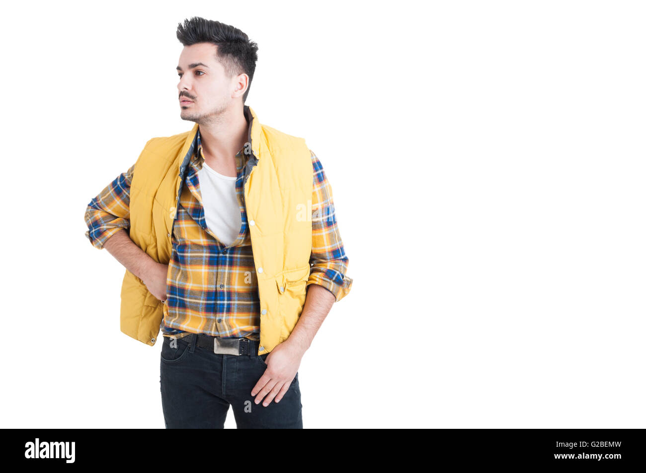 Portrait of attractive stylish man looking one side and holding his ...