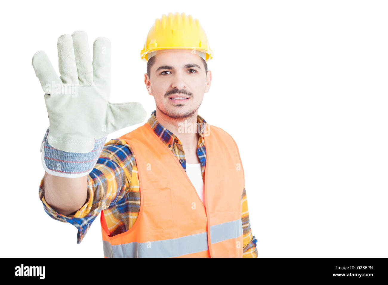 Cheerful builder showing number five or doing high five gesture ...