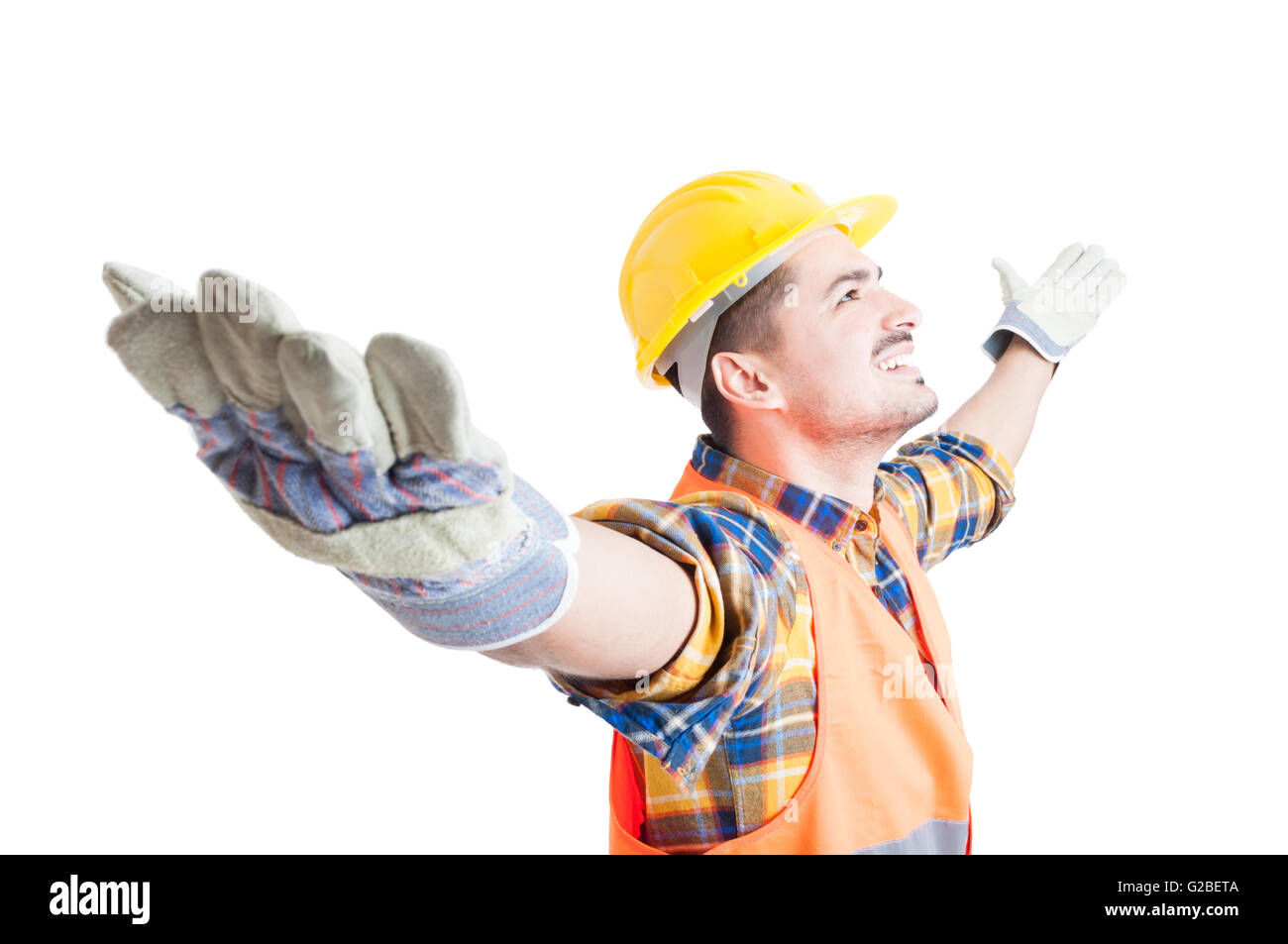 Portrait of happy constructor with arms wide open celebrating success ...