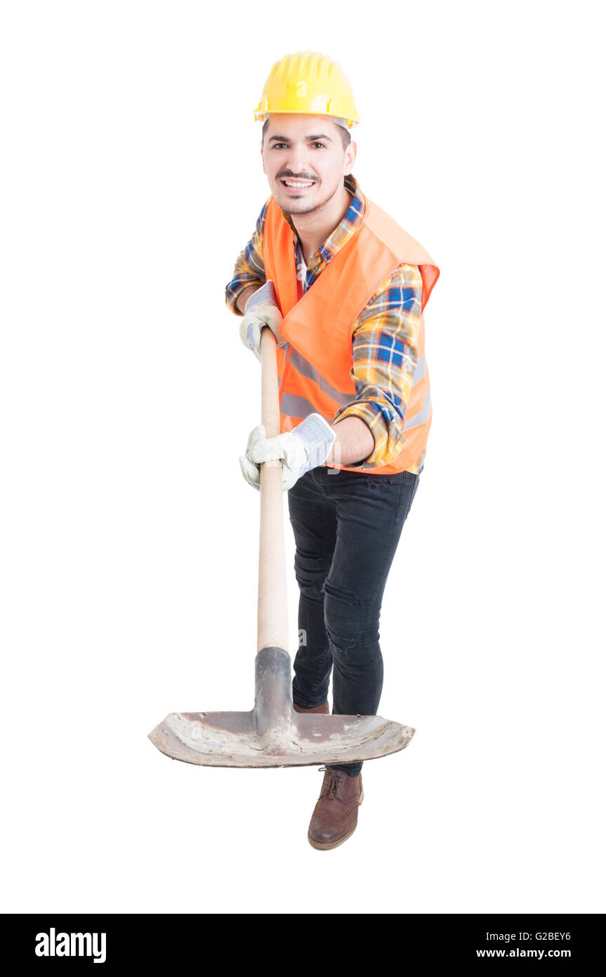 Digging concept with young engineer and shovel acting cheerful on white ...
