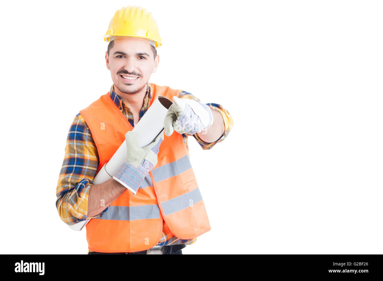 Attractive smiling engineer with helmet pointing finger on you while ...