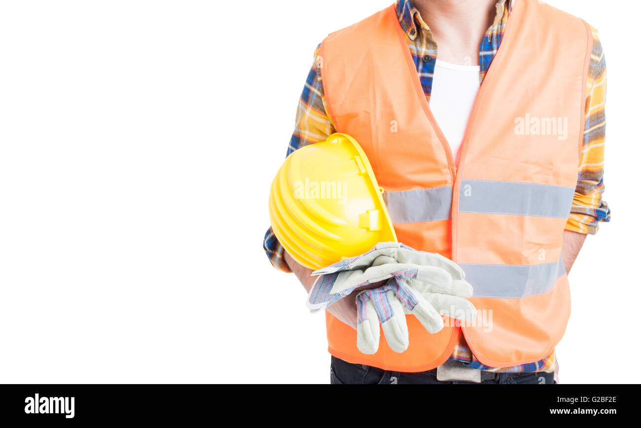 Closeup engineer holding helmet and wearing vest and gloves for safe ...