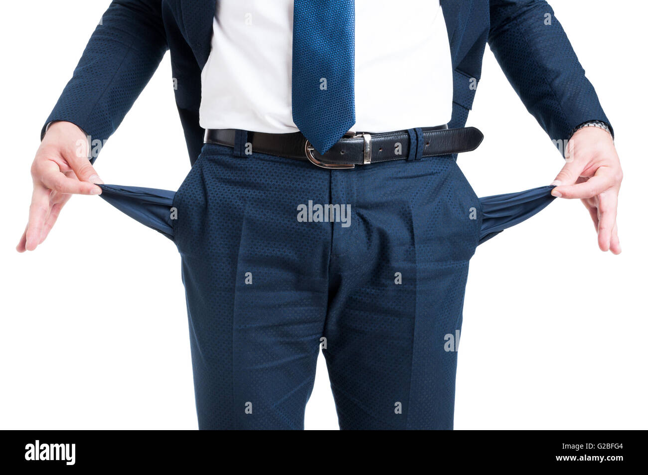 Poor businessman showing empty pants pockets isolated on white ...