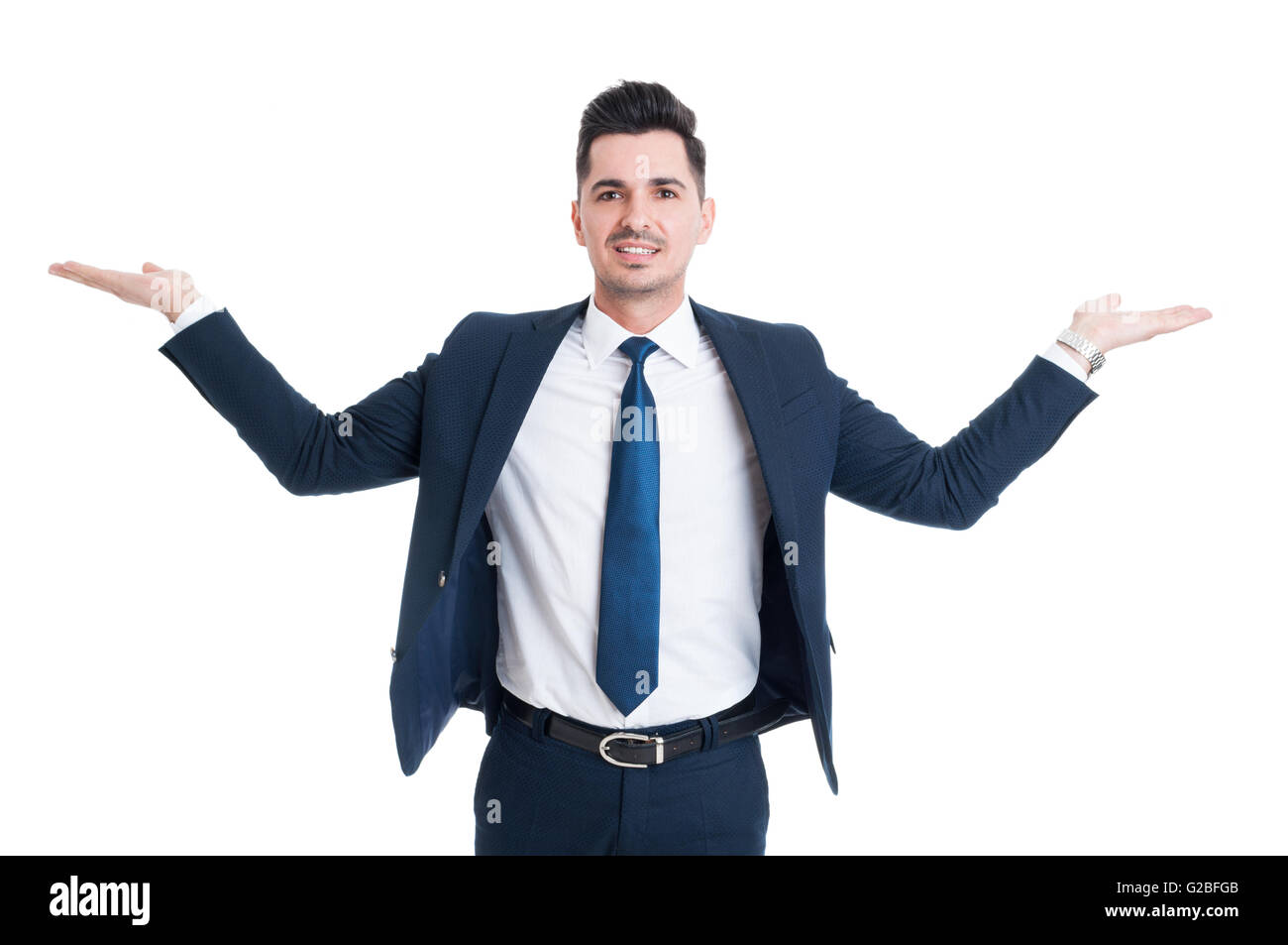 Businessman holding palms up as scale or balance. Weighing copy space ...