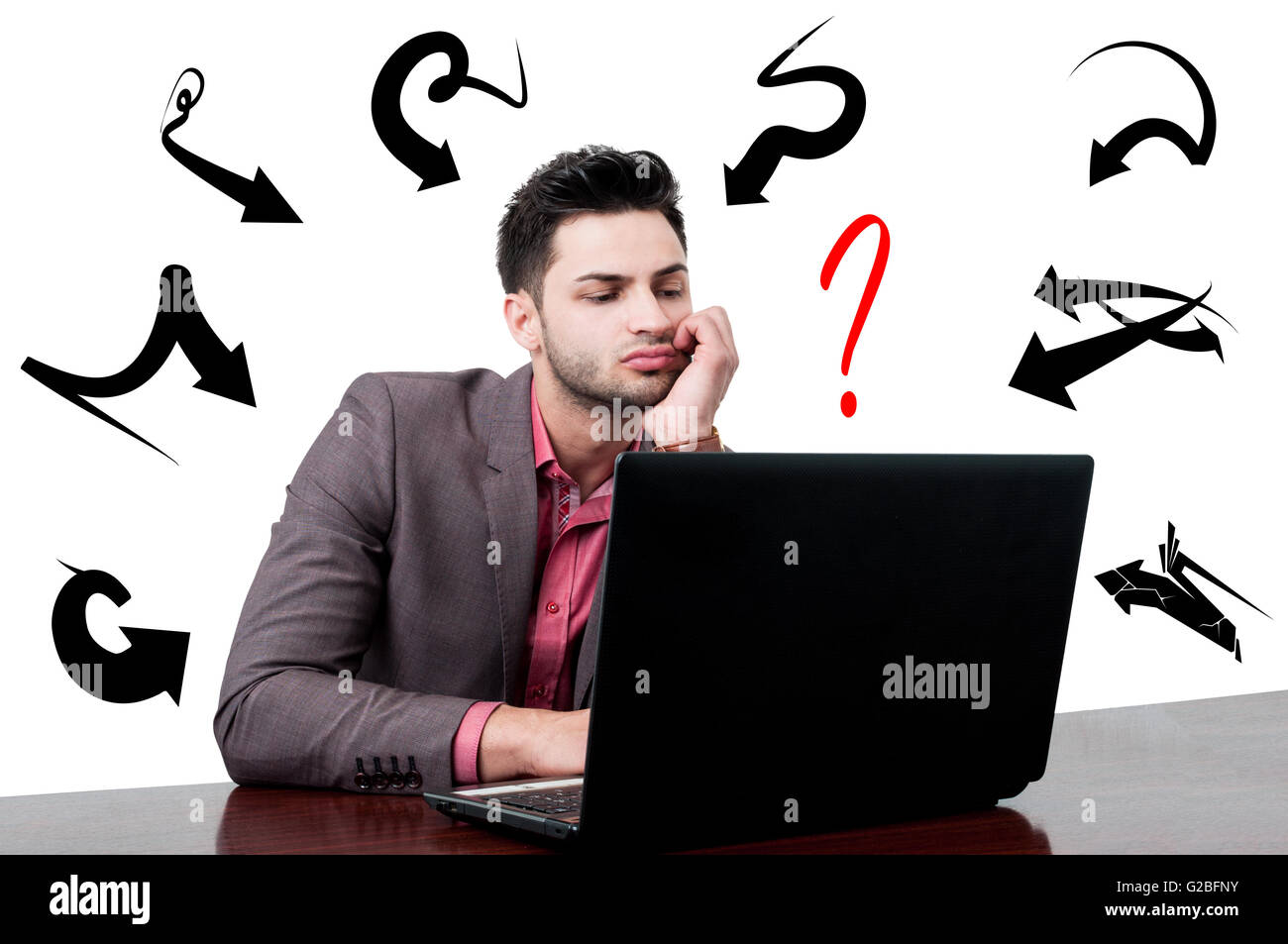 Attractive tired businessman working on his computer and taking a ...