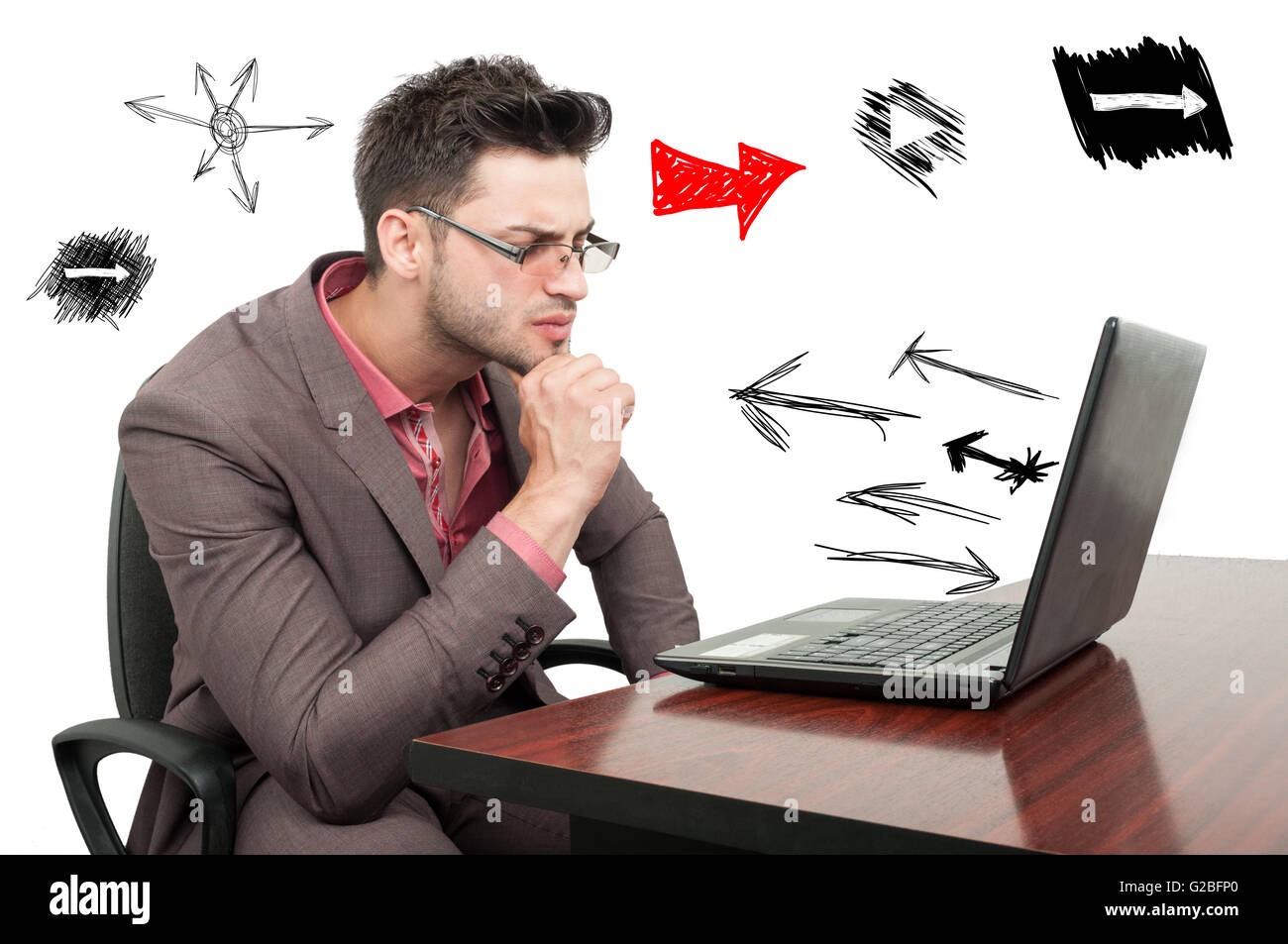 Pensive young employee trying to solve a business problem sitting on ...