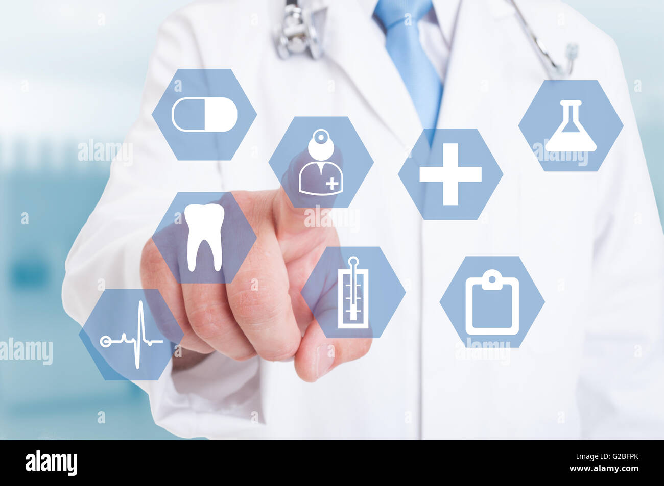 Doctor finger using a touch screen interface with medical icons as ...
