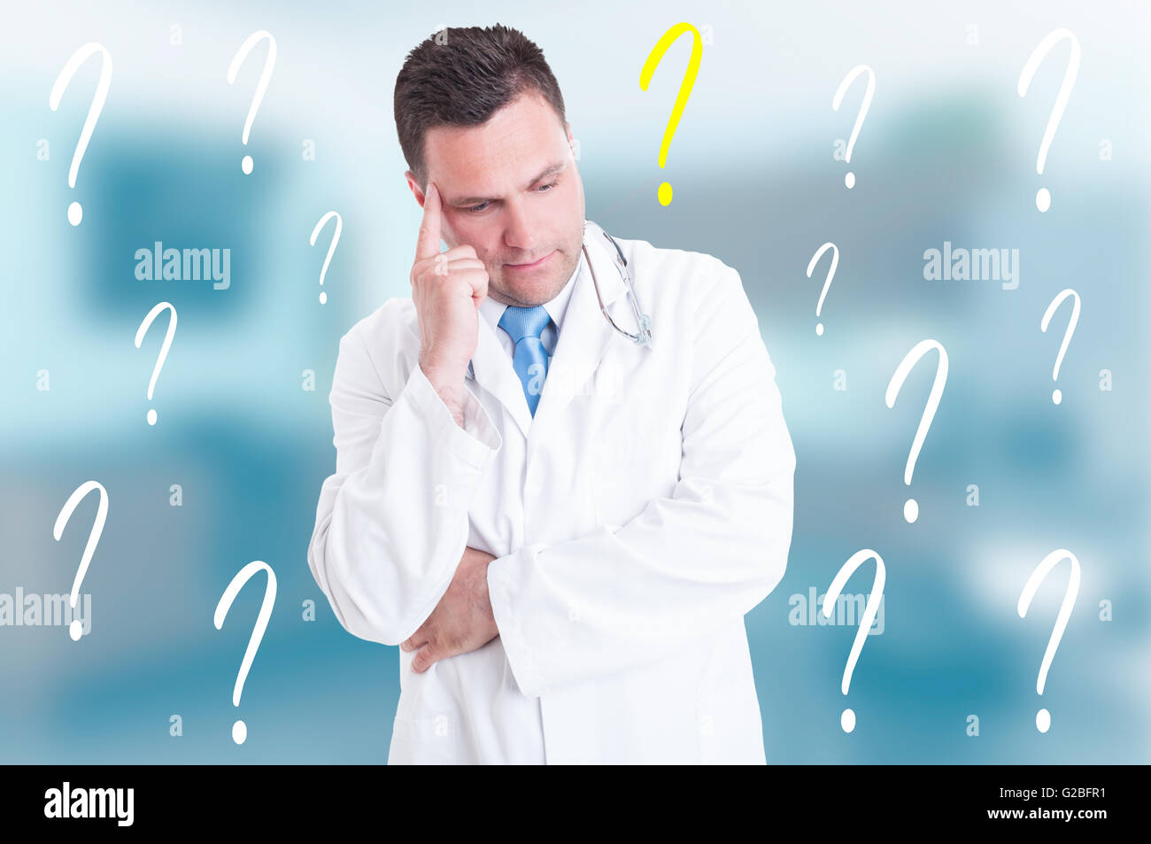 Professional pensive doctor thinking of an idea looking serious with ...