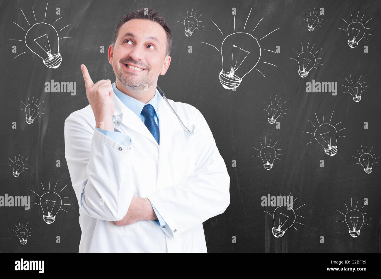 New idea in medicine with cheerful confident doctor pointing finger up ...