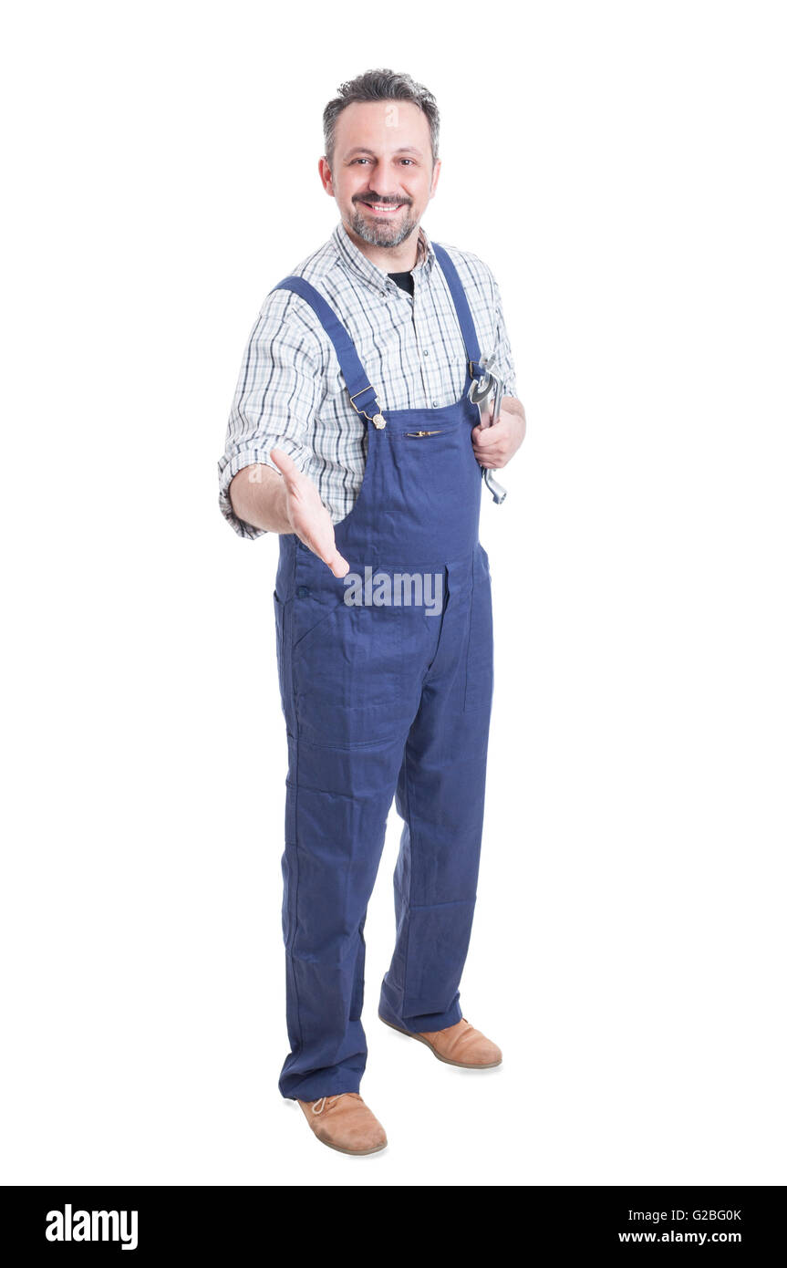 Handsome repairman or mechanic ready to handshake as greeting or ...