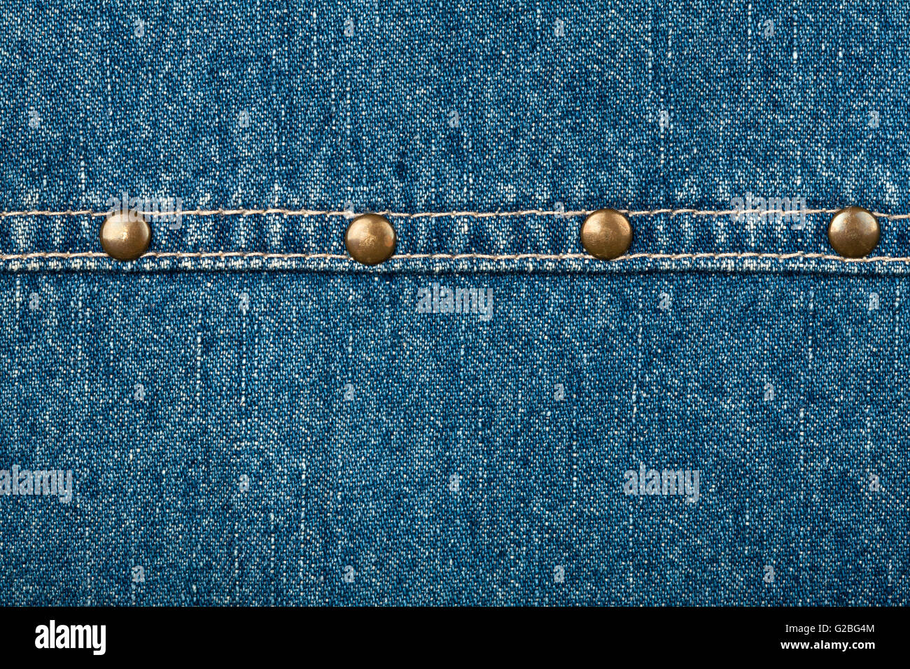 Worn blue jeans texture with rivets Stock Photo - Alamy