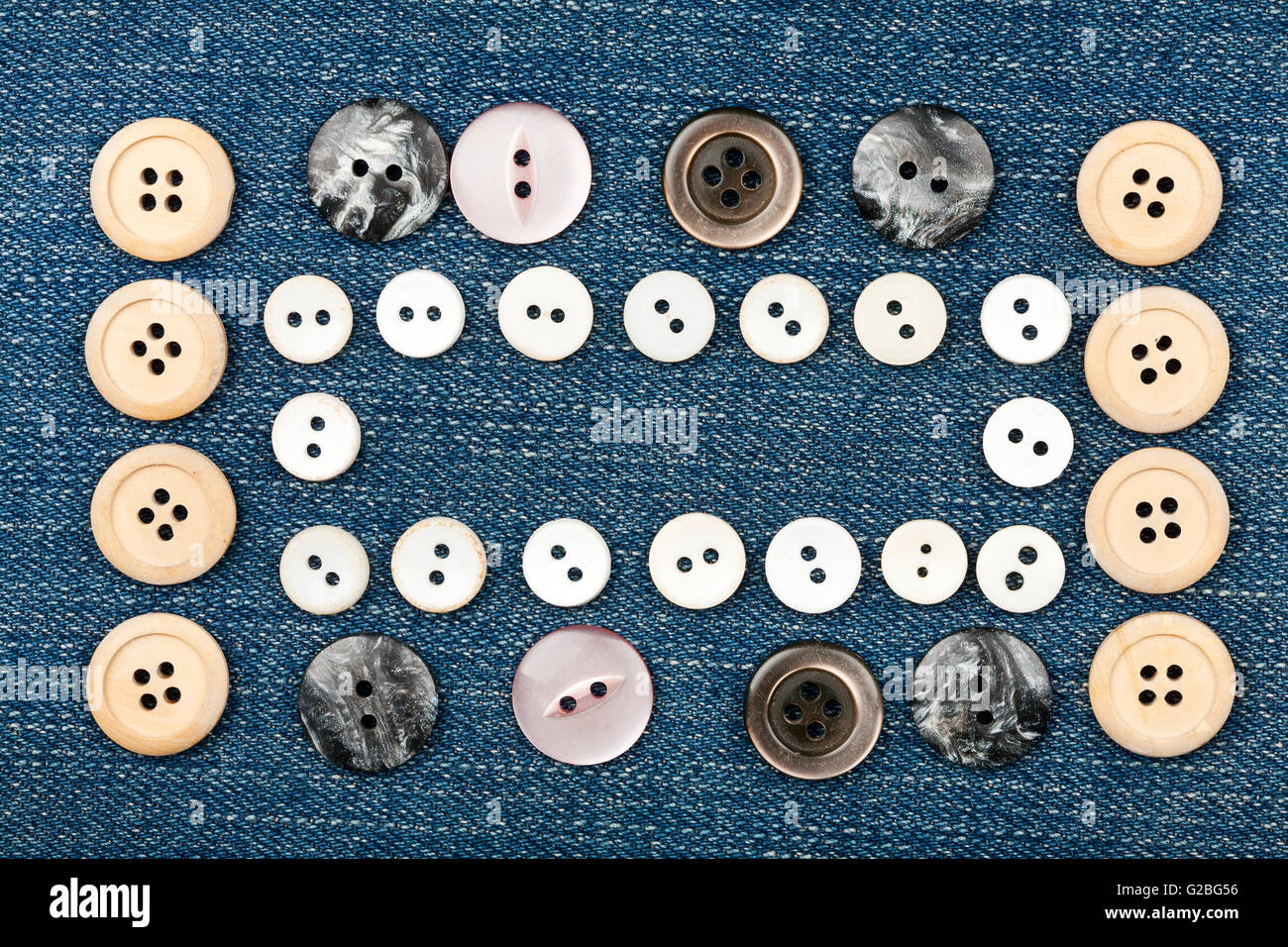 Buttons on blue jeans forming rectangle frame Stock Photo - Alamy