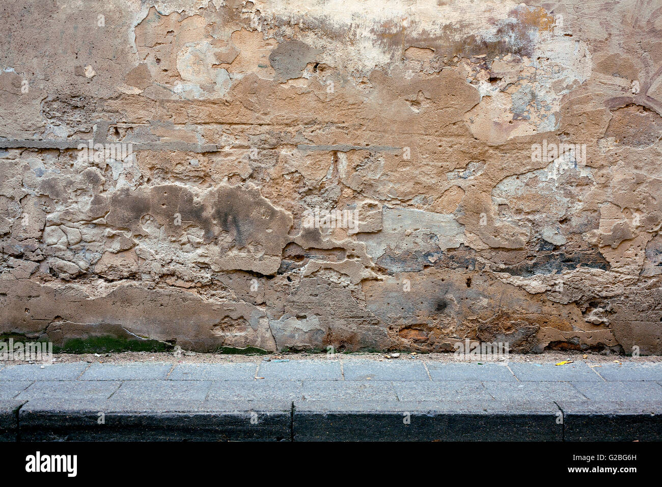 Old weathered wall of bricks and a ground Stock Photo - Alamy