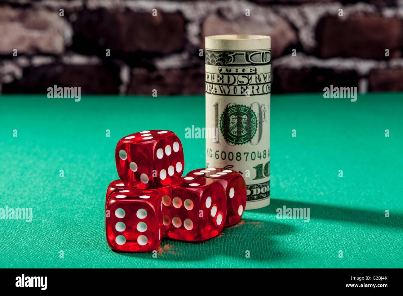 Dice and money on green table with shadow Stock Photo - Alamy