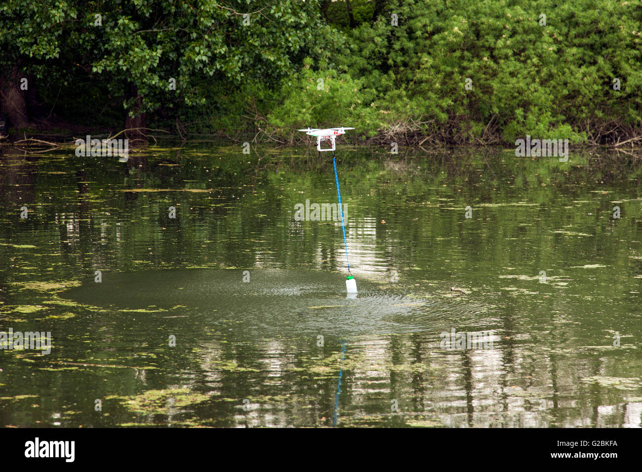 A drone takes a water sample in a pond Stock Photo - Alamy