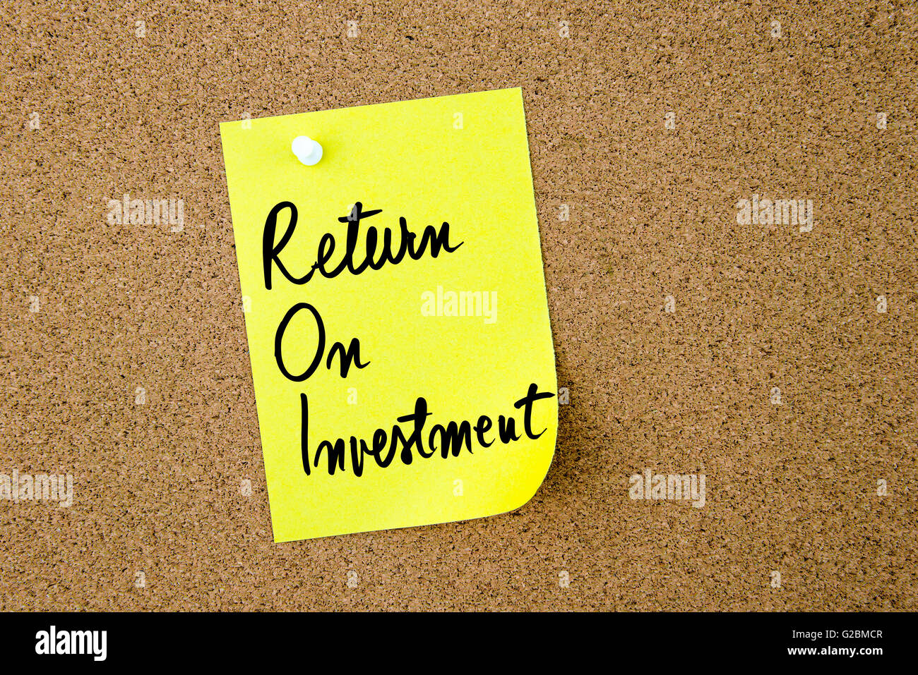 Business Acronym ROI Return On Investment written on yellow paper note ...