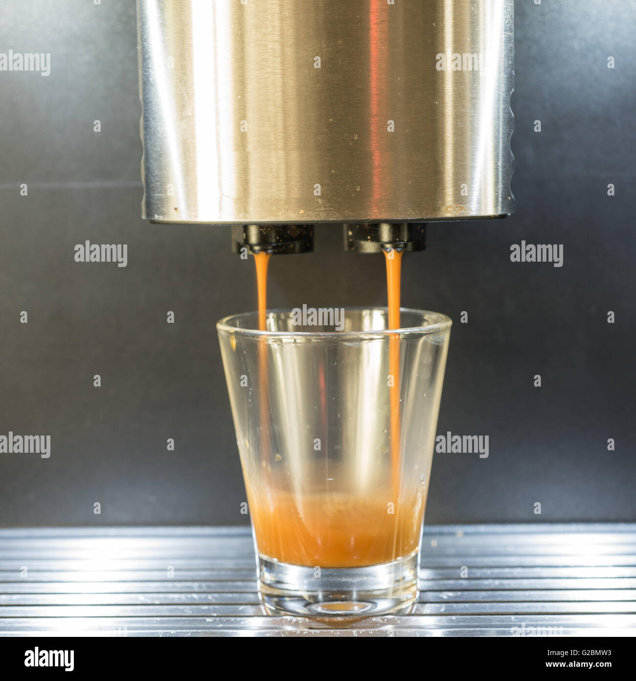 coffee poring freshly brewed from the coffee machine Stock Photo - Alamy