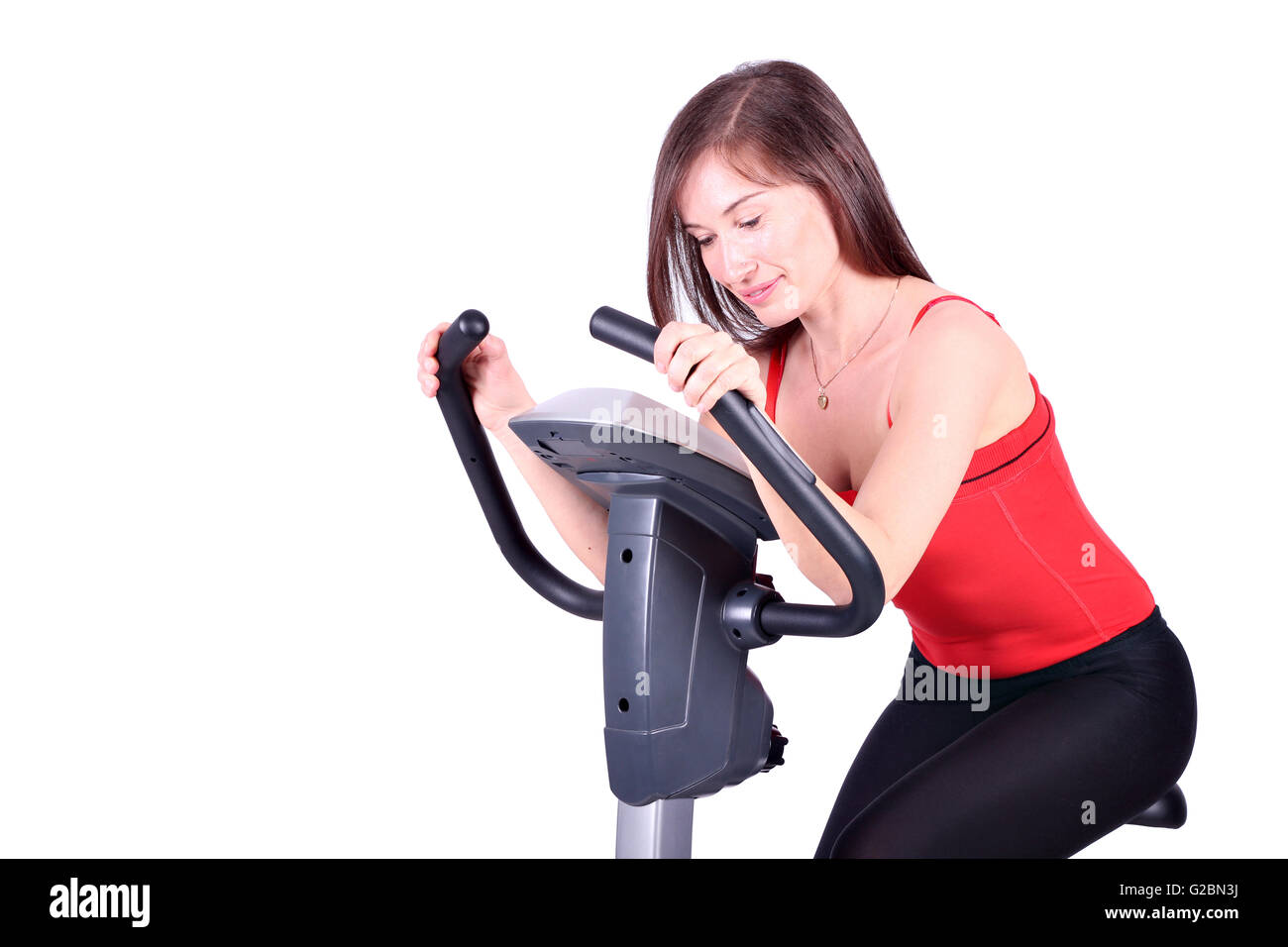 girl on cross trainer fitness exercise Stock Photo - Alamy