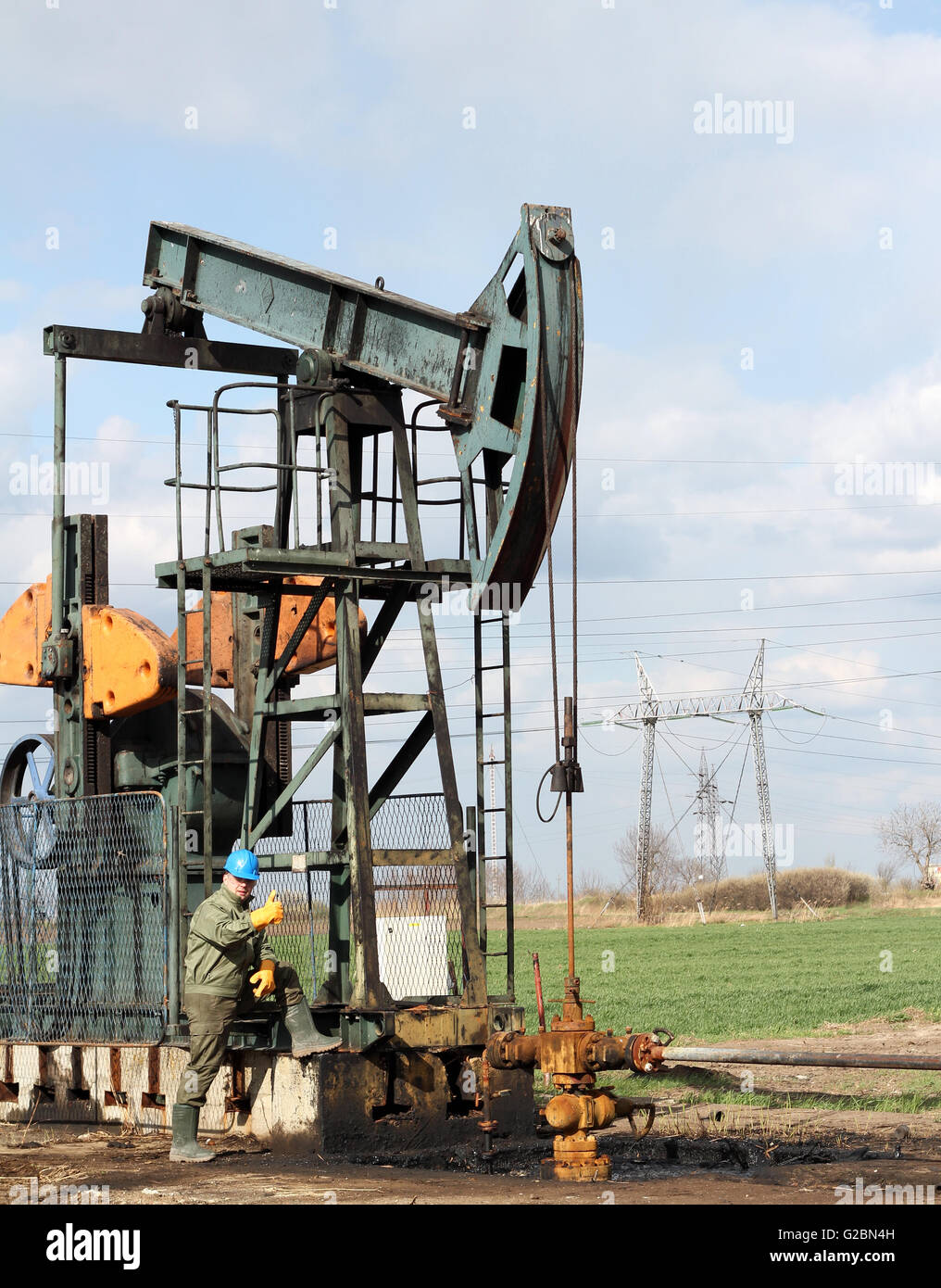 oil worker with thumb up Stock Photo - Alamy