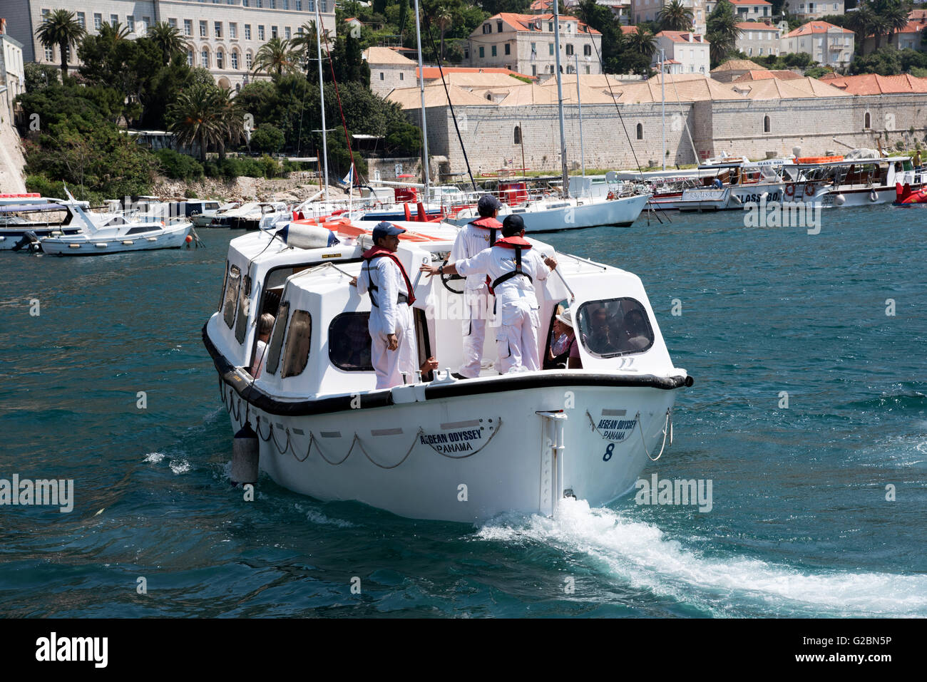 DUBROVNIK HARBOR CROATIA Cruise ship crew operating a boat which has ...