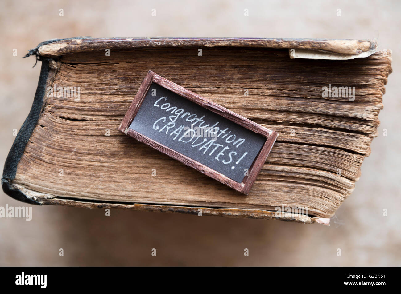 congratulations graduates text and vintage book Stock Photo - Alamy