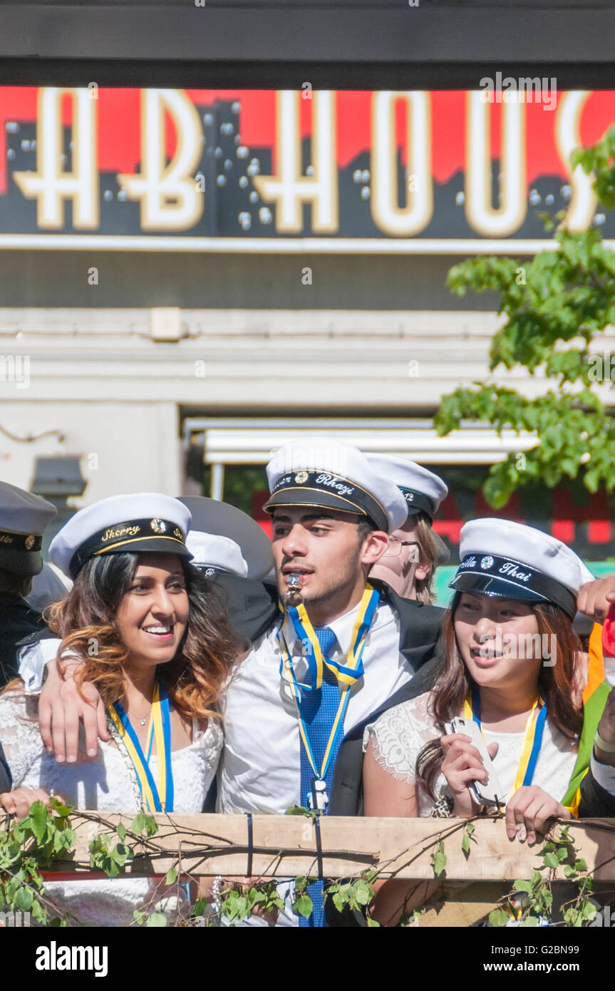 Graduates from different schools take part in a celebration parade ...